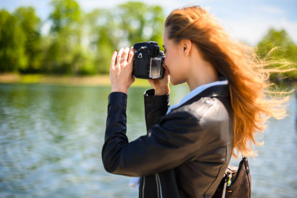 Free Stock Photo of Woman Holding Camera by Water | Download Free ...