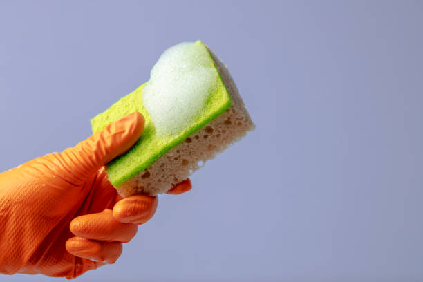Free Stock Photo of Hand Holding Sponge on Black Surface | Download ...
