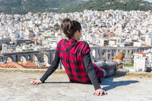 Free Stock Photo of Person Sitting on Ledge Above City | Download Free ...