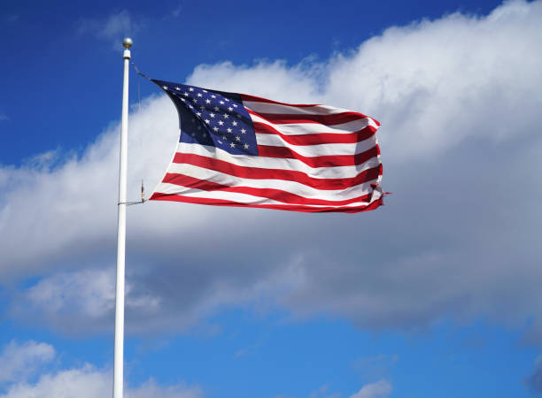 Free Stock Photo of American flag waving under blue sky with clouds ...