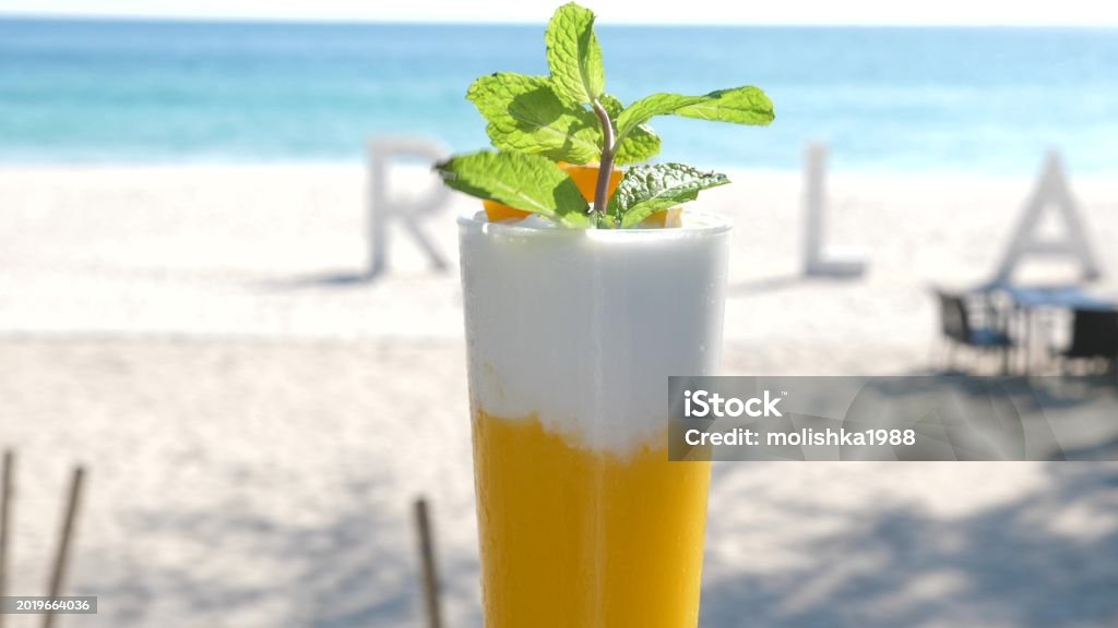 Tropical Cocktail Glass On Beach Bar Table With Clear Blue Ocean Stock