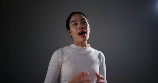Free Stock Photo of Young woman projecting her voice towards the viewer ...