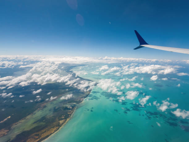 Free Stock Photo of Airplane Wing Flying Over the Ocean | Download Free ...