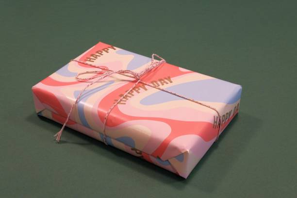 Free Stock Photo of Present Wrapped in Wrapping Paper With Red Bow ...