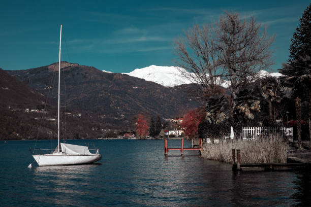 Solitary Sailboat on Lake Geneva with Dramatic Alpine Backdrop a | Free ...