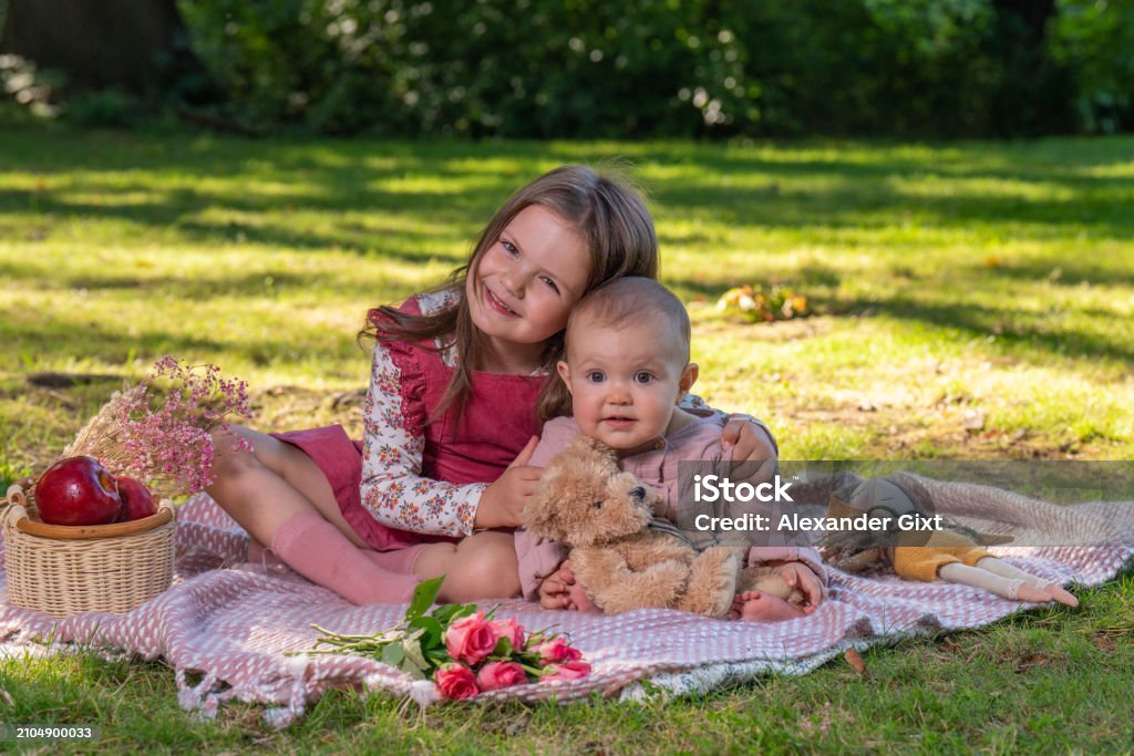 Portrait Of Cute Girls 5 Years Old And 1 Year Old Two Sisters On A