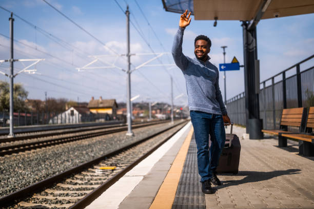 Free Stock Photo of Man Walking Next to a Train With Suitcase ...