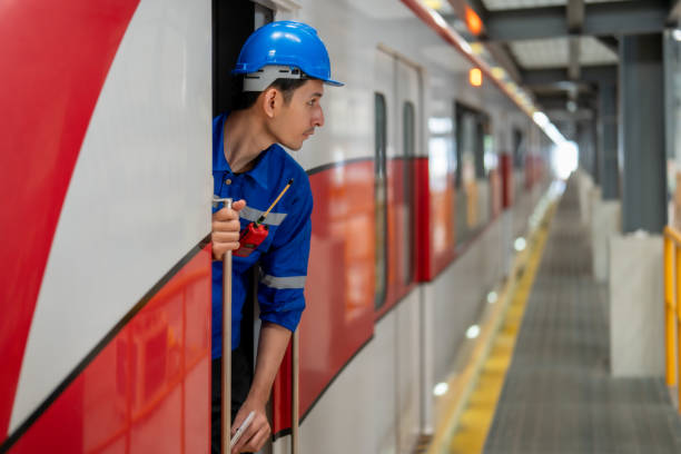 Free Stock Photo of Subway worker leaning out train door | Download ...