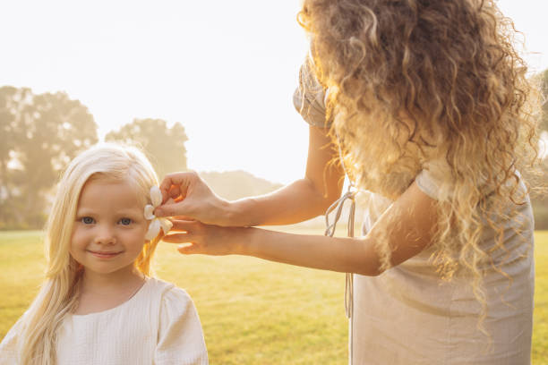 Free Stock Photo of Mother braiding daughter s hair in park | Download ...
