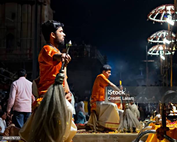 Priests Performing Ganga Aarti On Banks Of Holy River Ganges In One Of ... Priests Performing Ganga Aarti On Banks Of Holy River Ganges In One Of ...
