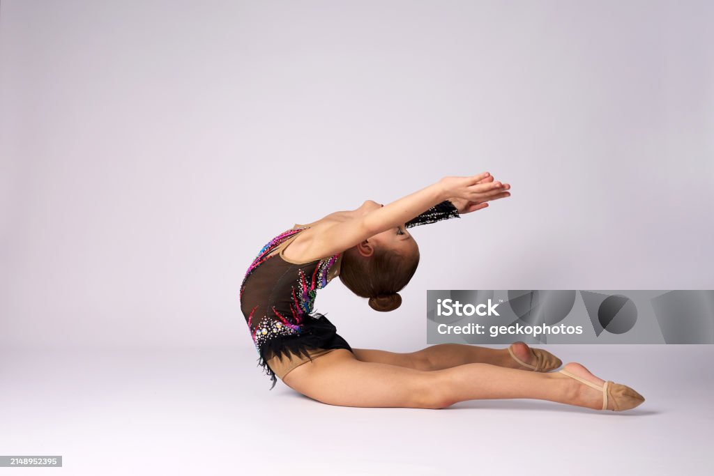 Portrait Of A Rhythmic Gymnastics Artist On A White Background Stock