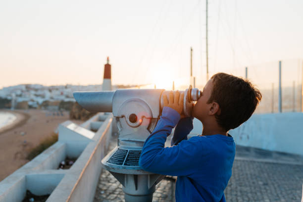 Free Stock Photo of Person looking through telescopes on seaside ...