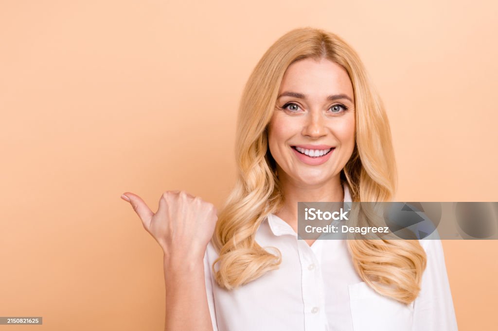 Portrait Of Blonde Curly Hair Smiling Mature Woman Wear White Shirt