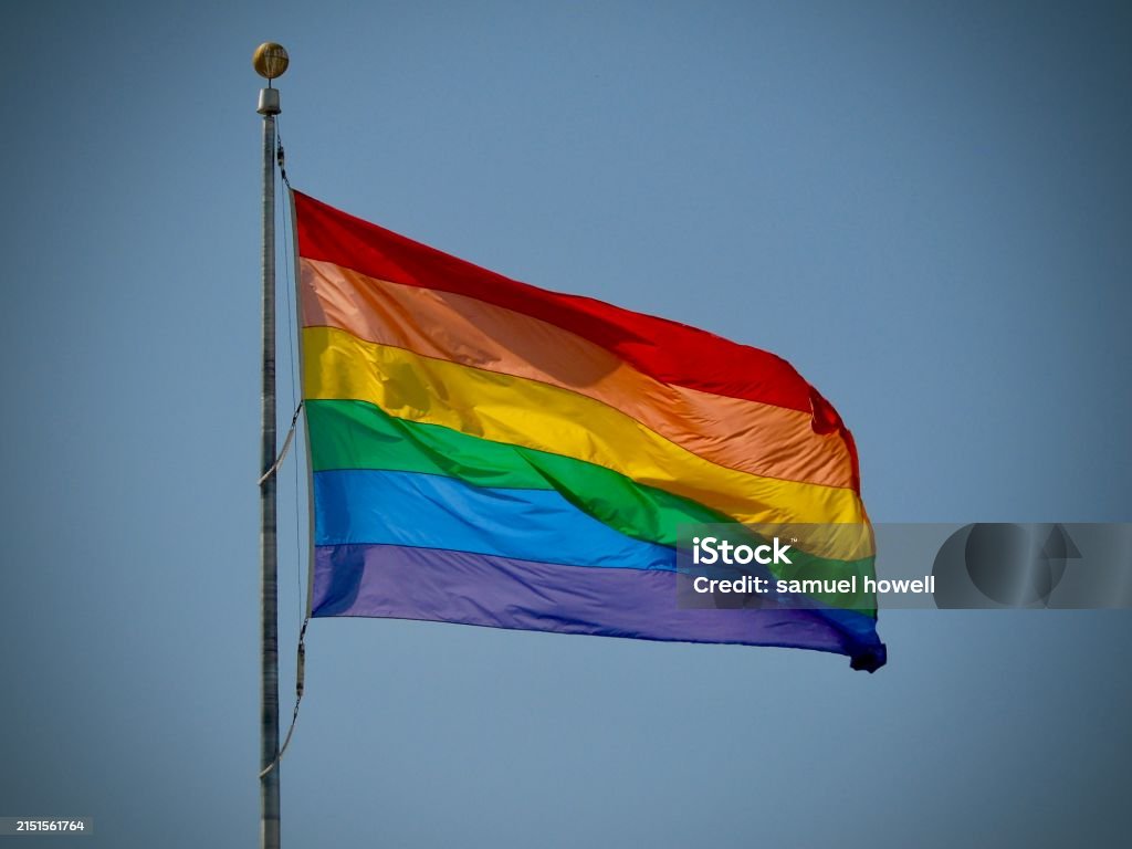 The Symbol Of Gay Pride One Rainbowcolored Lgbt Flag Flies Proudly In