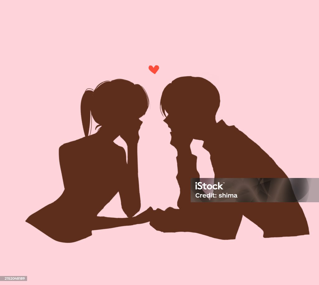 Silhouette Of A Man And Woman Facing Each Other And Holding Hands Stock