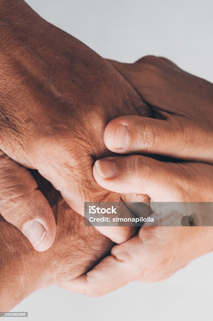 Close Up Middle Aged Mommys Wrinkled Hands Holding Young Daughters