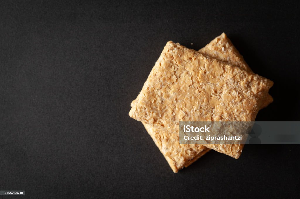 Two Pieces Of Indian Mithai A Delicate Soft Crunchy Gajak Bar Made Of