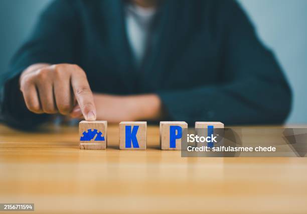 Wooden Cubes With A Kpi Word And Icons Key Performance Indicator