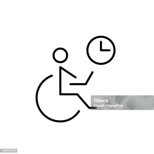 Wheelchair User At A Laptop With A Clock Inclusive Workspace And
