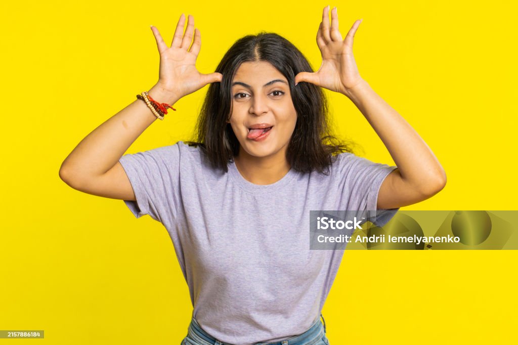 Cheerful Funny Bully Indian Woman Showing Tongue Making Silly Faces