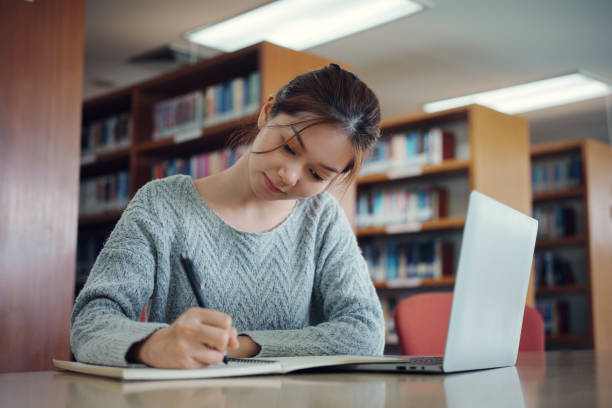 Free Stock Photo of Woman in the library writing | Download Free Images ...