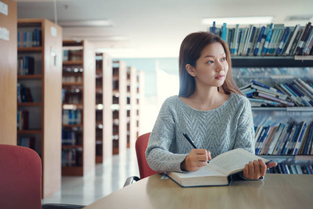 Free Stock Photo of Woman in the library writing | Download Free Images ...