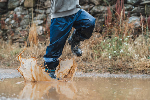 Free Stock Photo of Person jumping into a puddle splashing water ...
