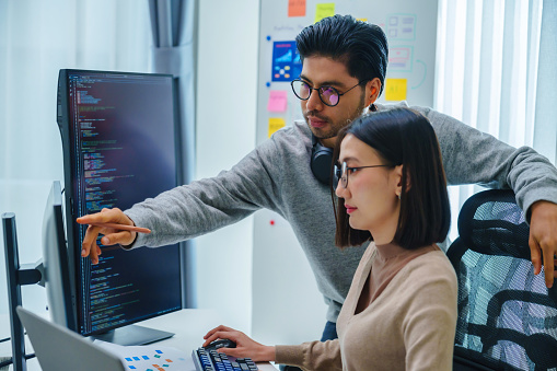 Asian And Indian Developer Team Discussion Feedback Analysis Coding Data With Software Computer