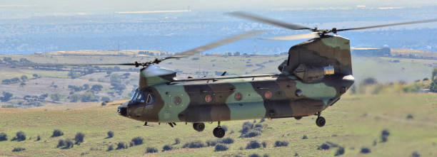 Boeing CH-47 Chinook Helicopter in Flight - Stock Photo