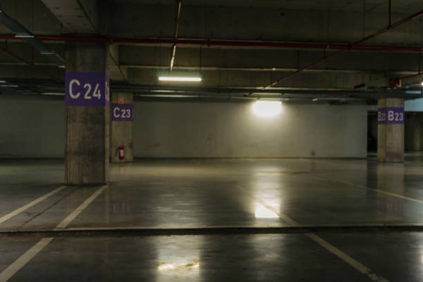 Free Stock Photo of Lone figure in a dimly lit parking garage ...