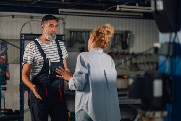 Free Stock Photo of Professional Mechanics talking in automotive shop ...