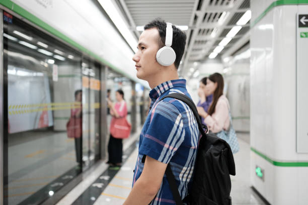 Free Stock Photo of Hand holding headphones in subway station ...