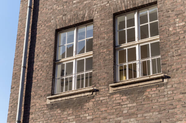 Free Stock Photo of Brick building facade with repeating window pattern ...