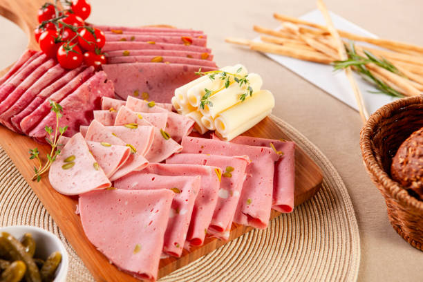 Free picture: Large rectangular rustic platter of sliced meat, sausage ...