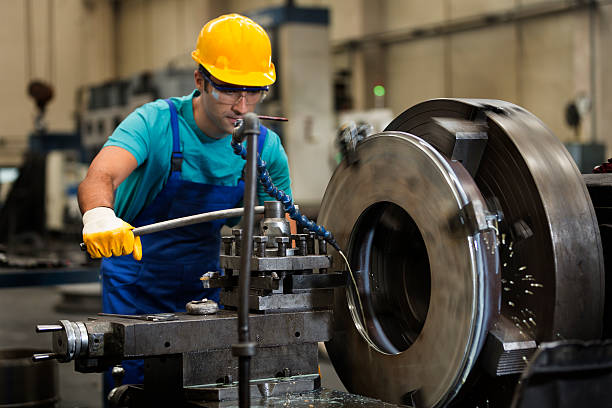 Free Stock Photo of Engineer metalworker working on lathe machine ...