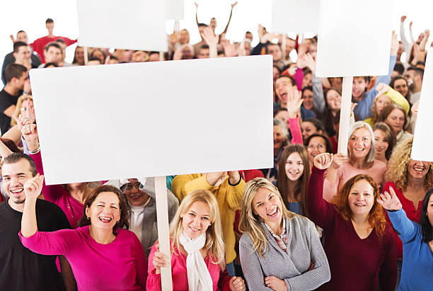 Free Stock Photo of Crowd of People Holding Up Signs and Hats ...