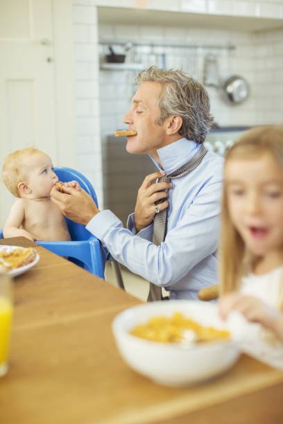 Daughter Feeding Her Father Cereal Stock Photos, Pictures & Royalty ... Daughter Feeding Her Father Cereal Stock Photos, Pictures & Royalty ...