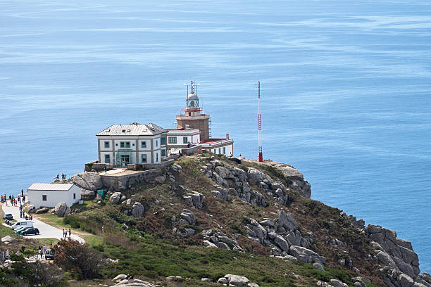 Free Stock Photo of Lighthouse Overlooking Hill by Ocean | Download ...