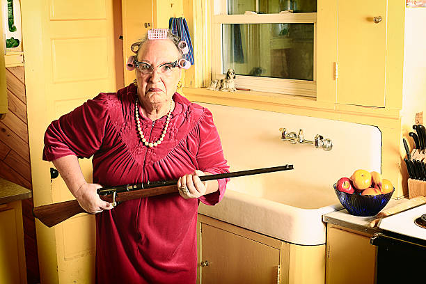 510 Bildbanksfoton Bilder Och Royaltyfria Bilder Med Old Woman Gun