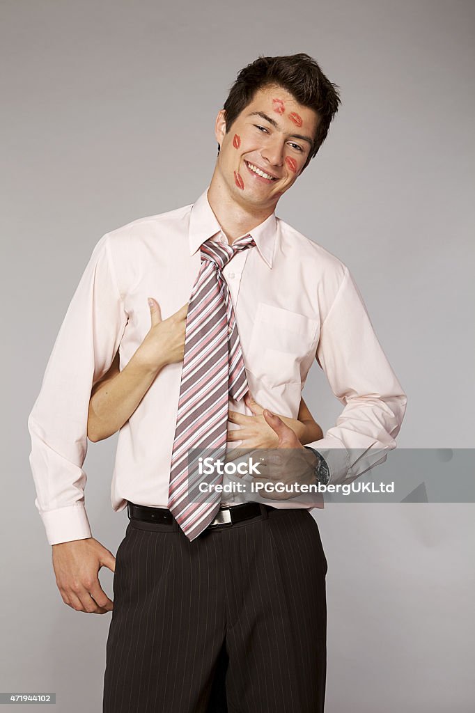Young Caucasian Businessman With Lipstick Kiss Mark On His Cheek Stock