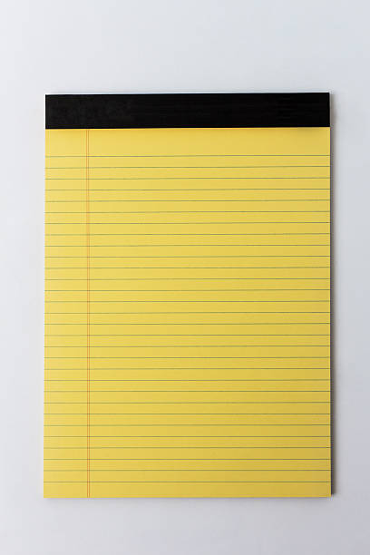 Free Stock Photo of A clipboard with yellow lined paper and a pen ...