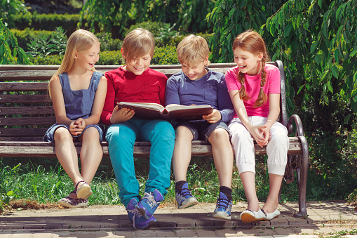 Nice Smiling Children Sitting On The Bench Stock Photo - Download Image ... Nice Smiling Children Sitting On The Bench Stock Photo - Download Image ...
