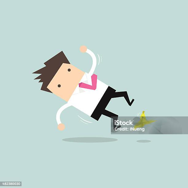 Businessman Slipping On A Banana Peel And Falling Down Stock