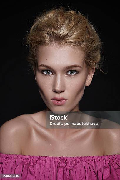 Young Beautiful Blonde Girl With Expressive Cheekbones And Collarbones