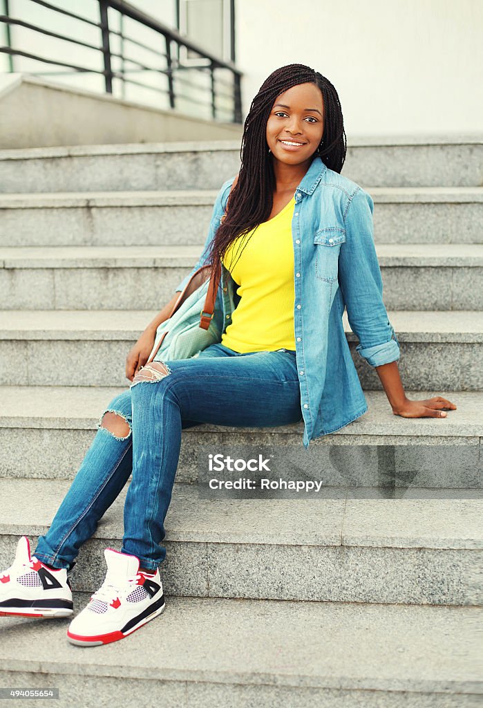 Beautiful Happy Smiling African Woman Wearing A Jeans Shirt And Stock