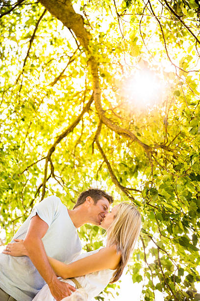 Free Stock Photo of Man and Woman Kissing Under Tree | Download Free ...