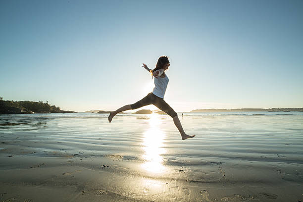 Free Stock Photo of Person Jumping in the Air on Beach | Download Free ...