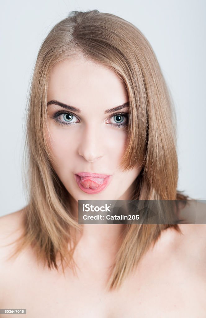 Beautiful Woman Model Sticking Tongue Out As Funny Face Concept Stock
