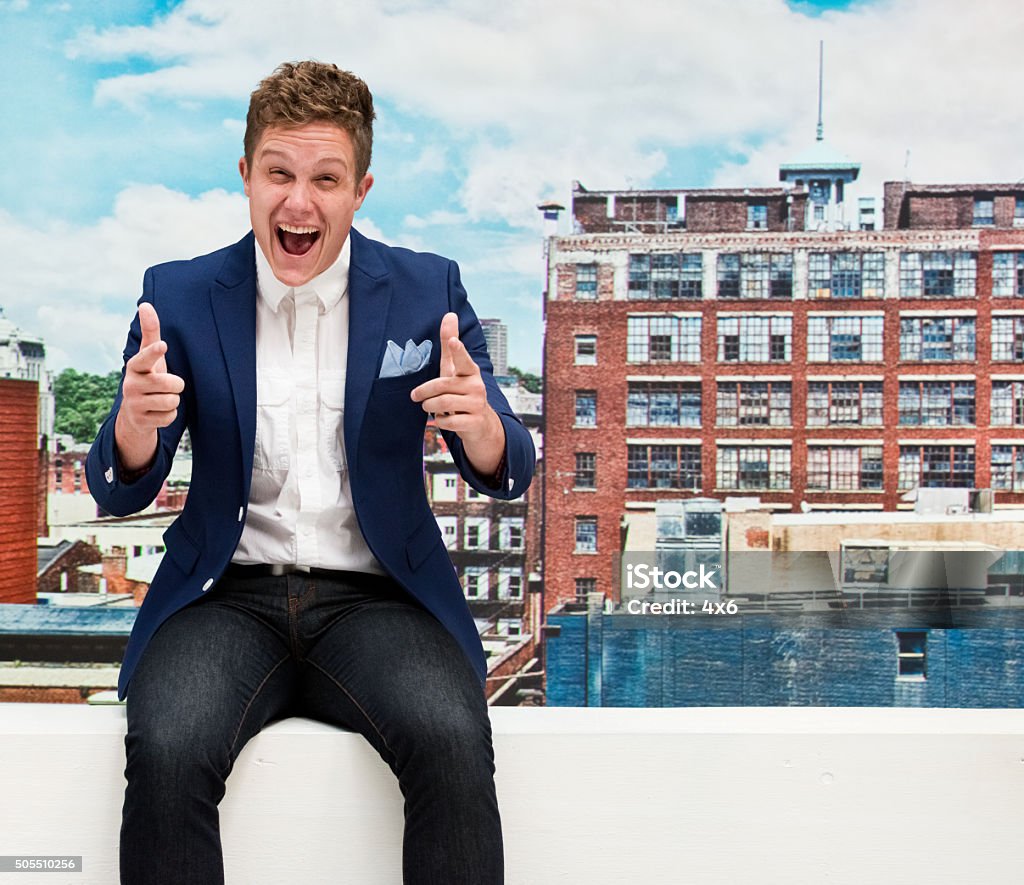 Cheerful Smart Casual Man Pointing Towards Camera Stock Photo ... Cheerful Smart Casual Man Pointing Towards Camera Stock Photo ...