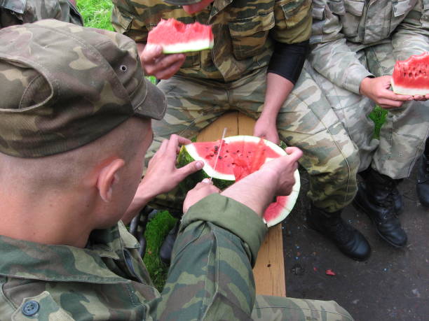 Free Stock Photo of Soldier Holding Piece of Watermelon | Download Free ...